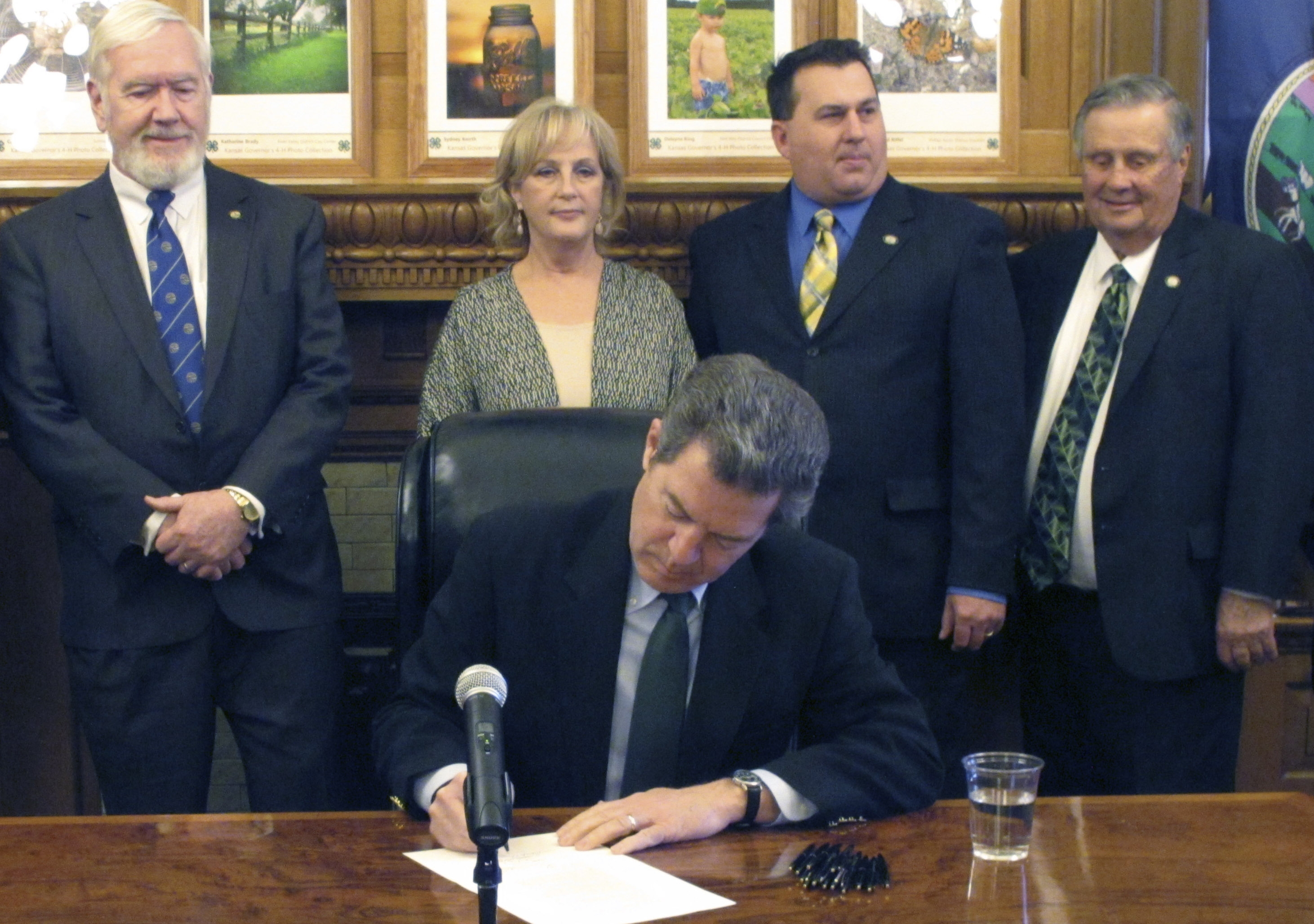 Brownback signs bills on sexting, revenge porn and local government ...